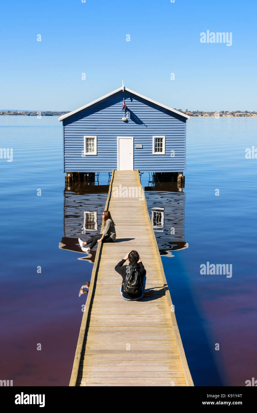 Tourists taking photos of the Crawley Edge Boatshed or Blue Boat House ...