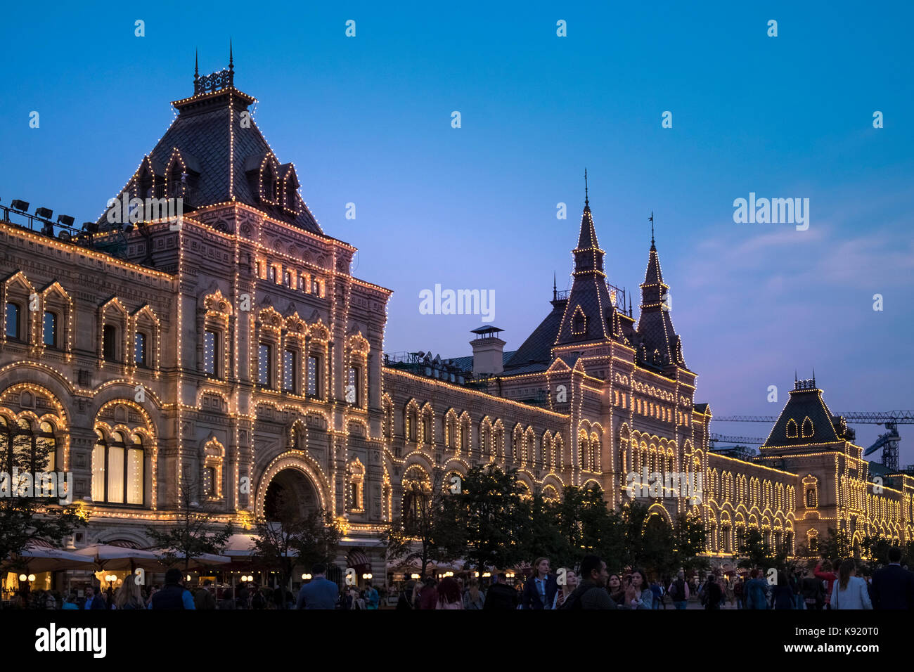 Exterior facade at twilight of the GUM department store with decorative ...