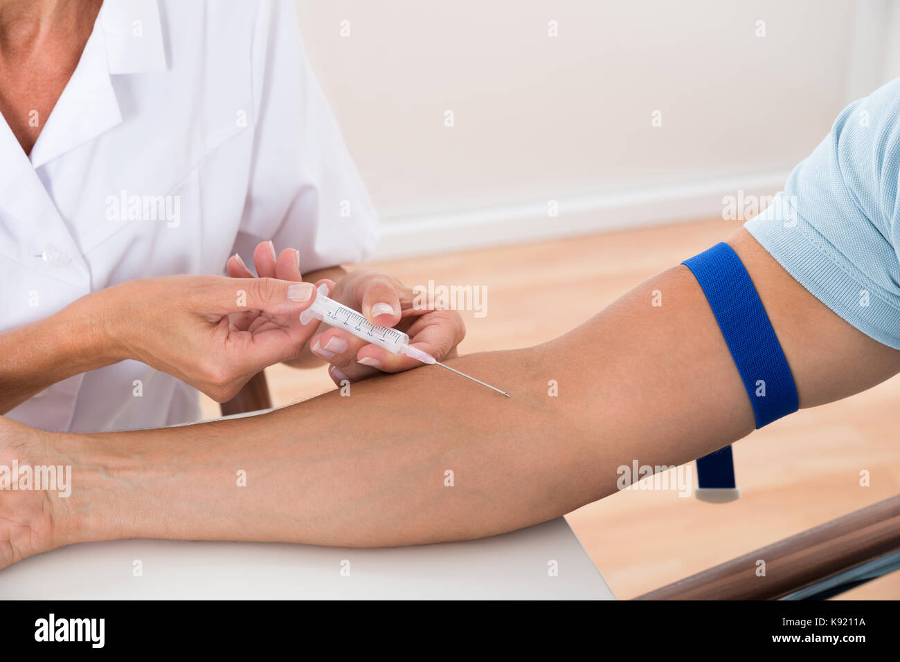 Close-up Of A Female Doctor Injecting Injection To Patient Stock Photo ...
