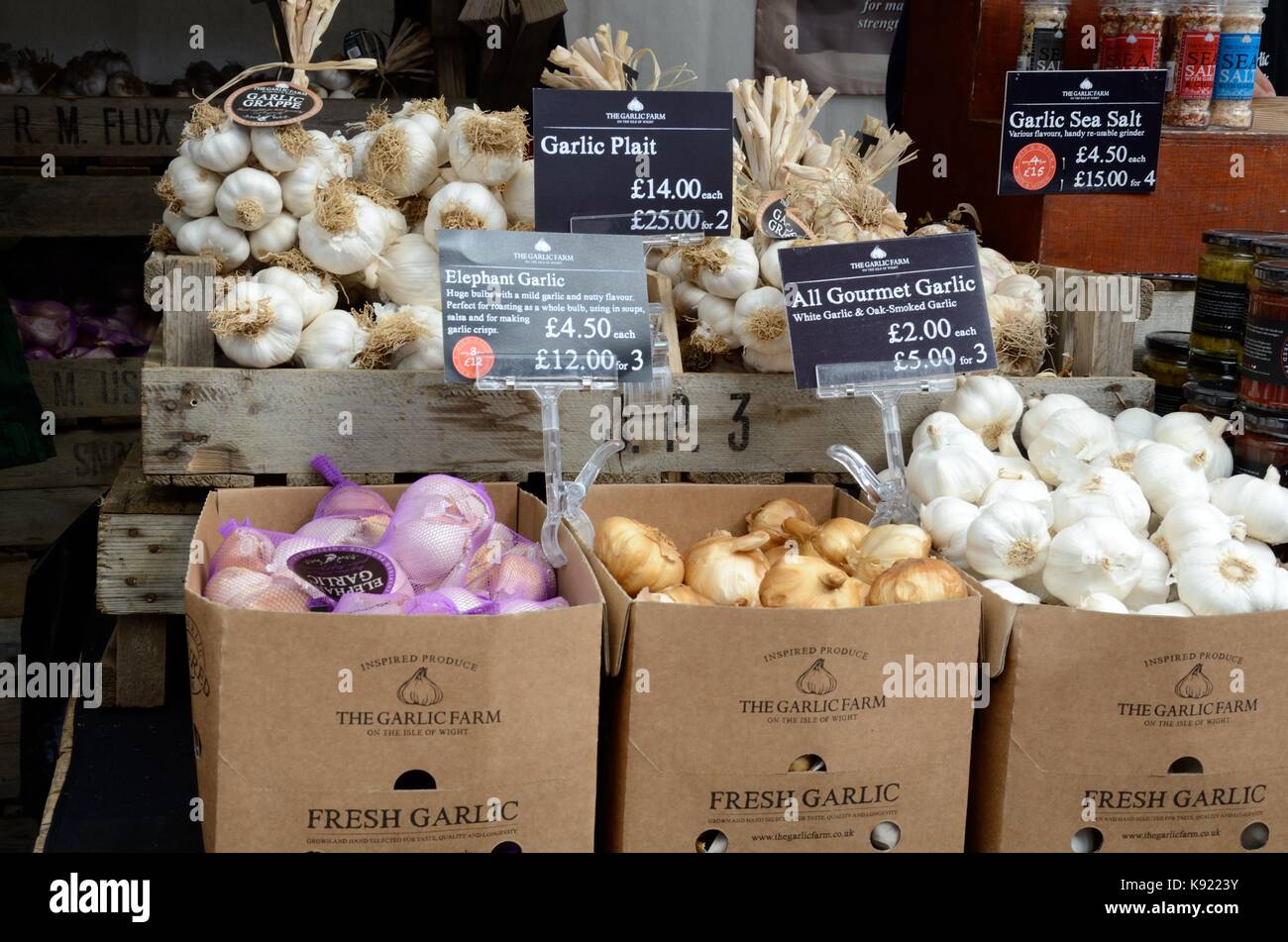 Boxes of different varieties of garlic from the Garlic Farm isle of ...