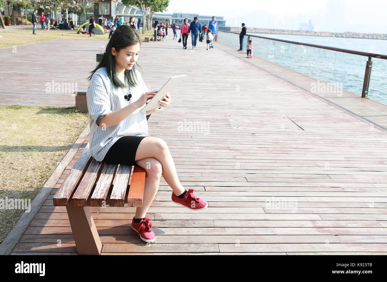 girl using the pad on the street Stock Photo - Alamy