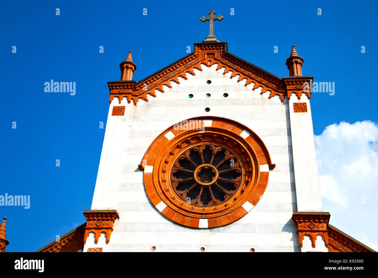 italy lombardy in the mercallo old church closed brick tower wall rose ...