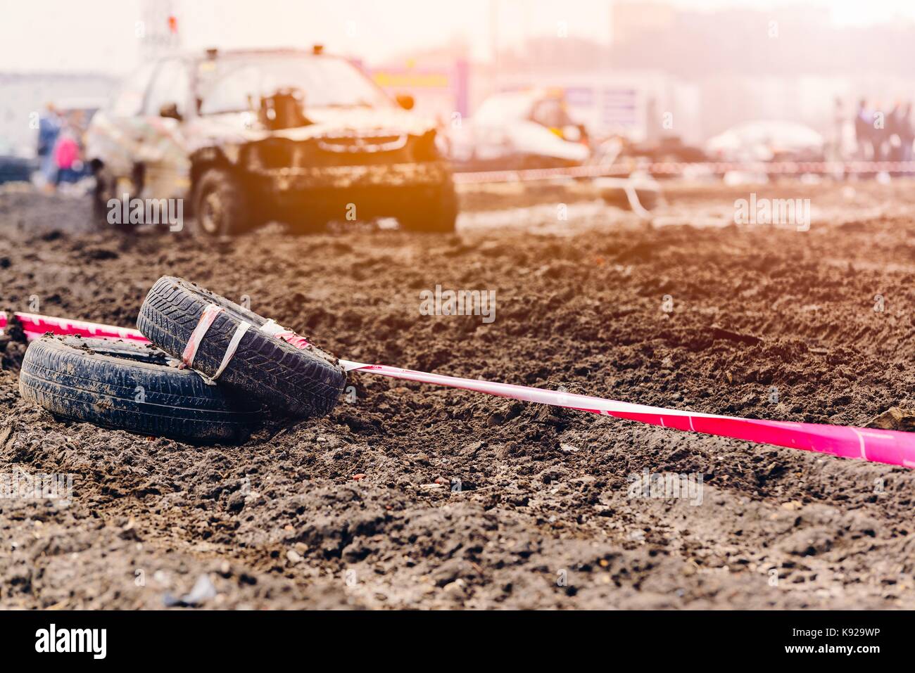 Wreck car dirt race on muddy track Stock Photo - Alamy