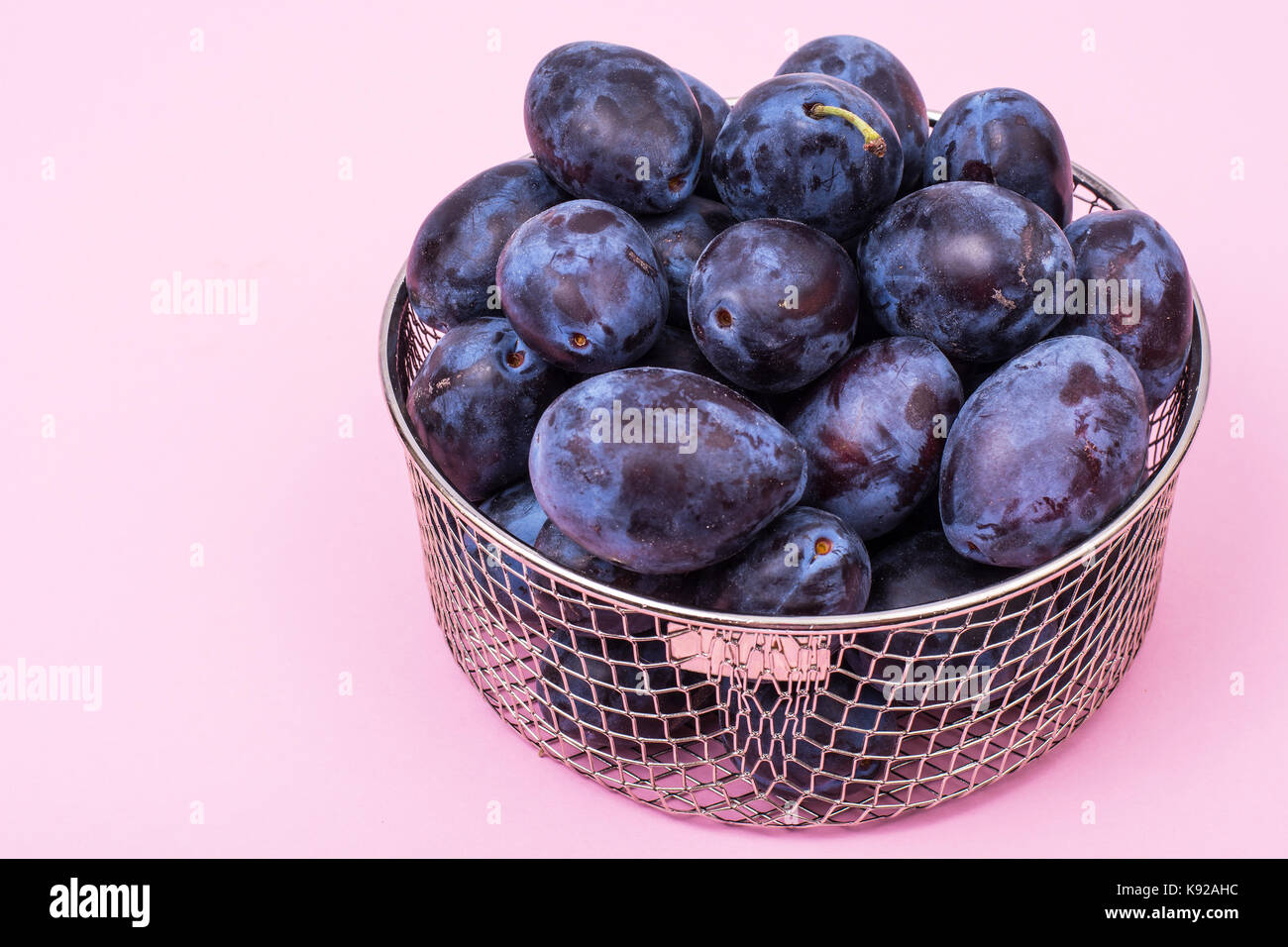 fresh blue plums on bright background. Studio Photo Stock Photo - Alamy