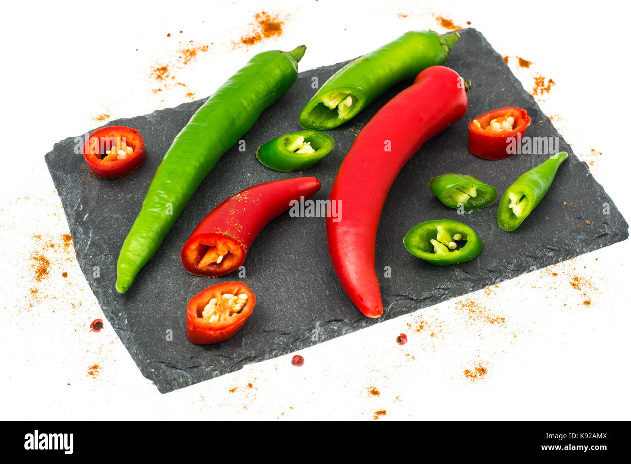 Colored chilli peppers on black stone. Studio Photo Stock Photo - Alamy
