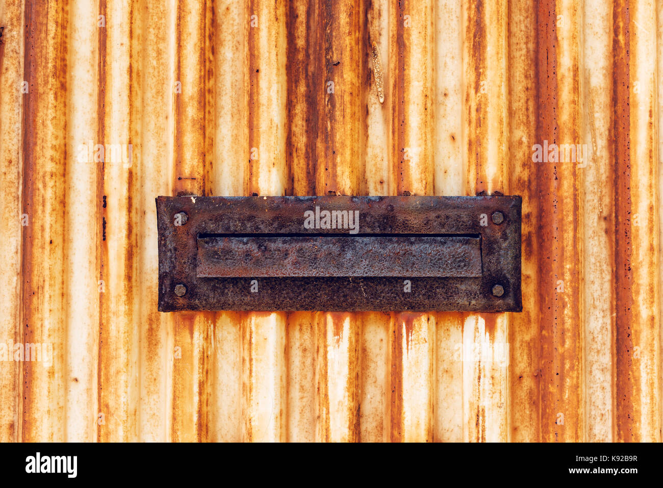 Weathered old rusty mail slot letterbox on metal doorway Stock Photo ...