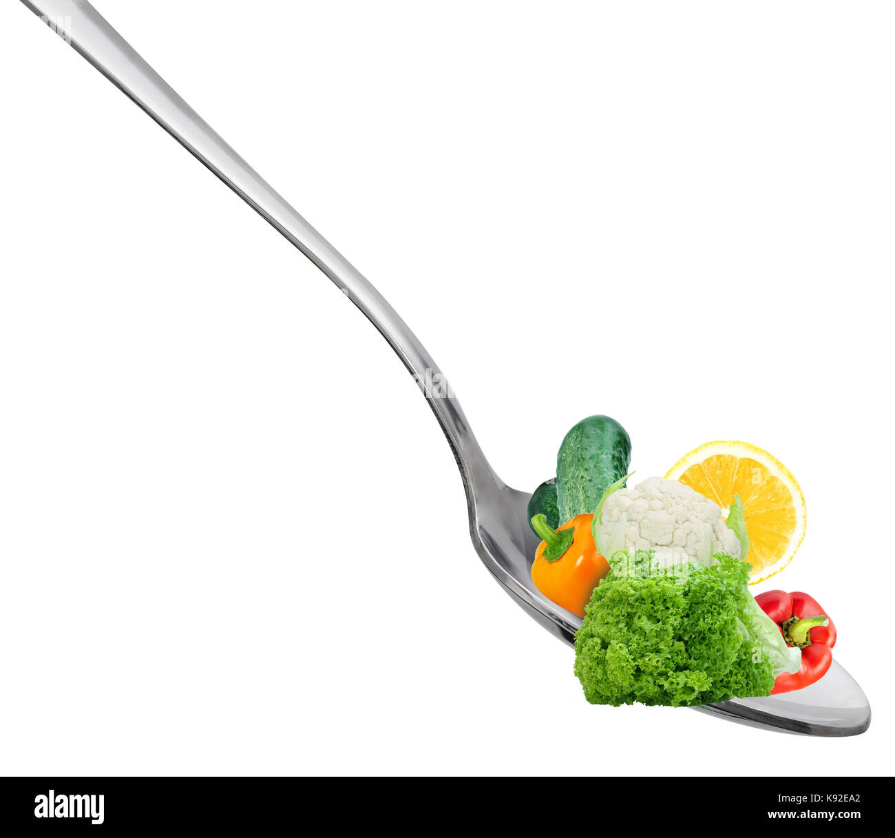 Vegetables on the spoon. Healthy food Stock Photo - Alamy