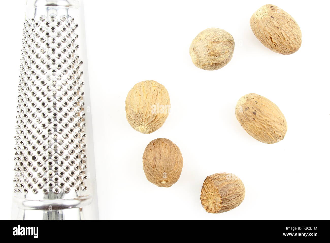 composition of nutmeg seeds isolated on a white background Stock Photo ...