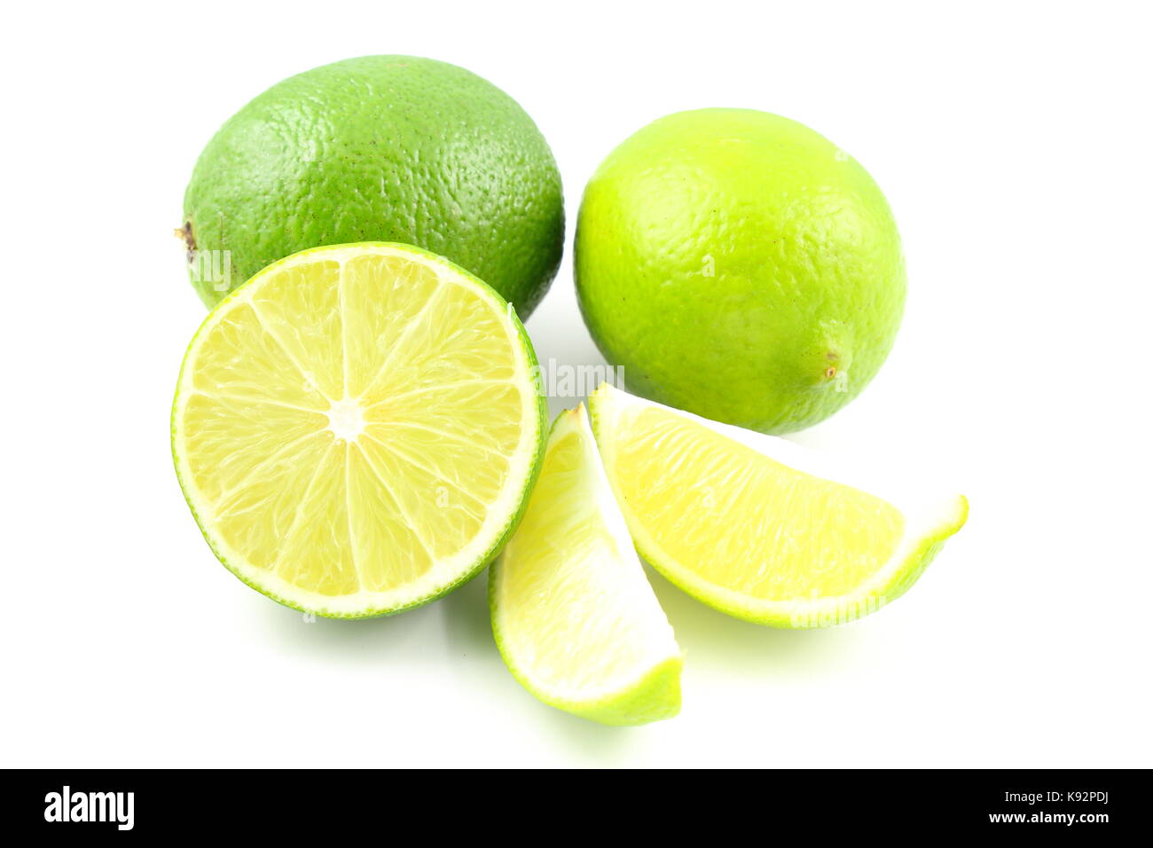 composition of fresh lime fruits isolated on a white background Stock ...