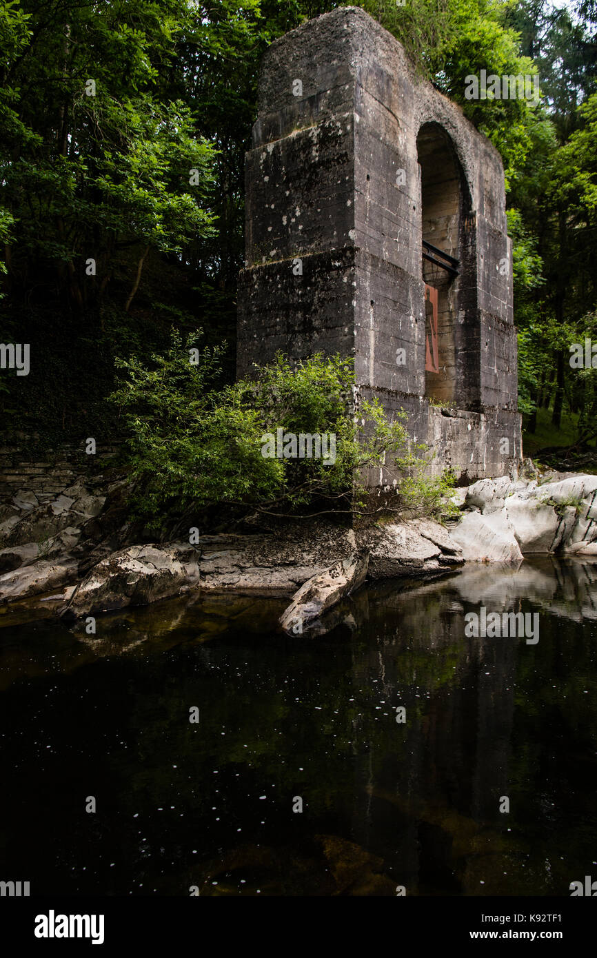 The remains of the old railway bridge over the River Wye near Rhayader ...