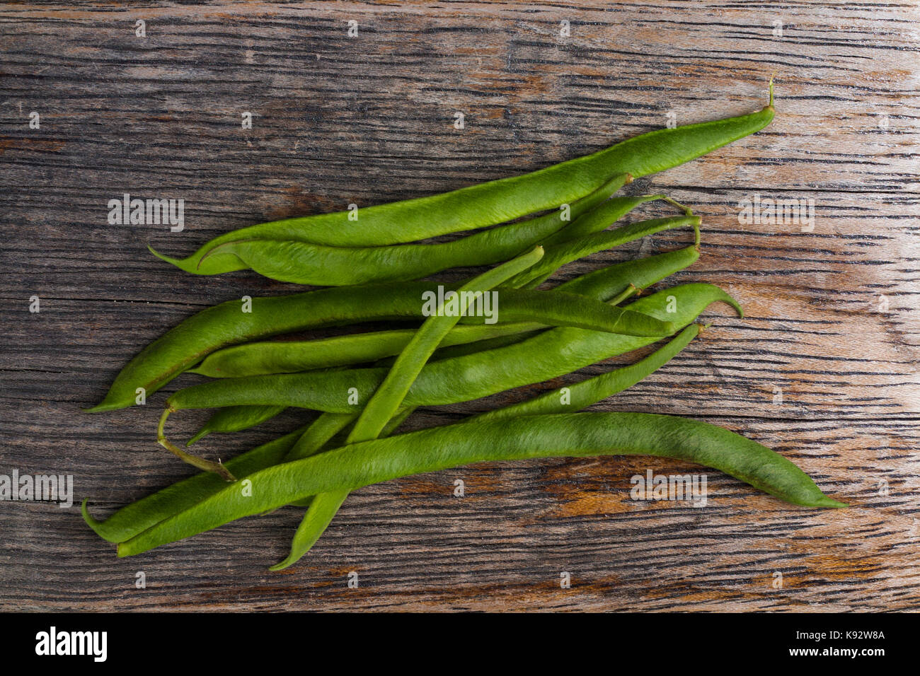 Freshly picked runner beans on a rough wooden bench Stock Photo - Alamy