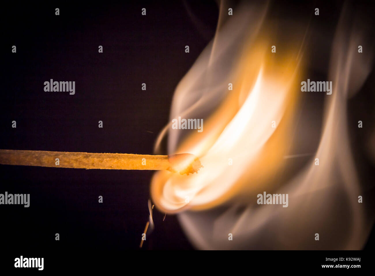 One quiet burning match on black background. Match burning details ...