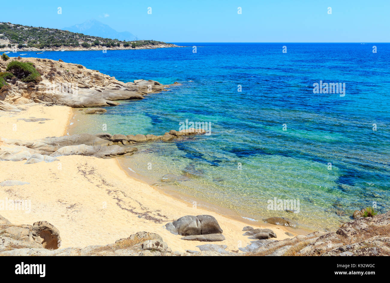 Summer sea scenery with aquamarine transparent water and sandy beach ...