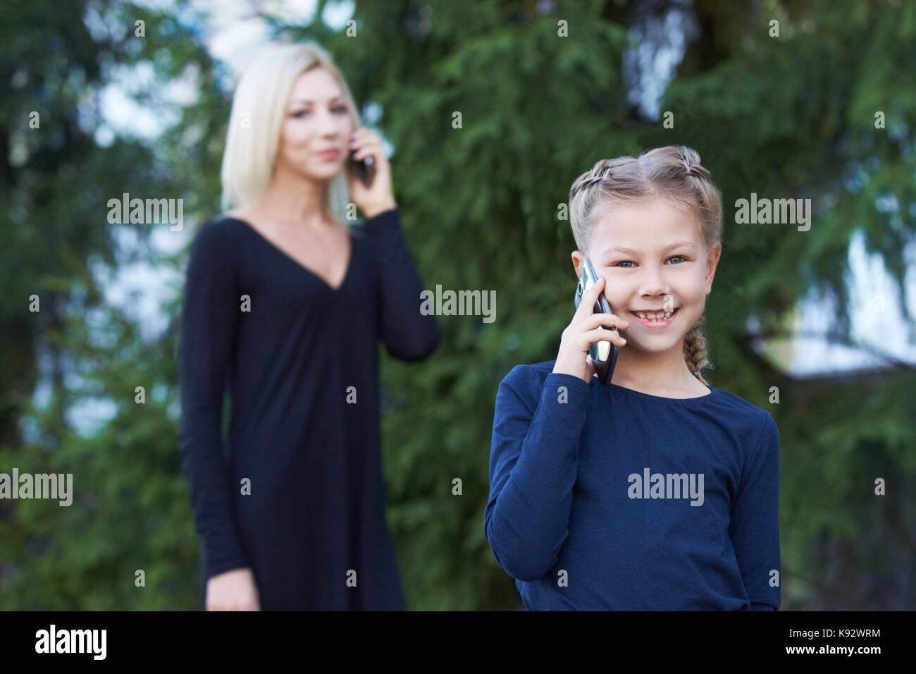 Mom and daughter. Phone conversation Stock Photo - Alamy