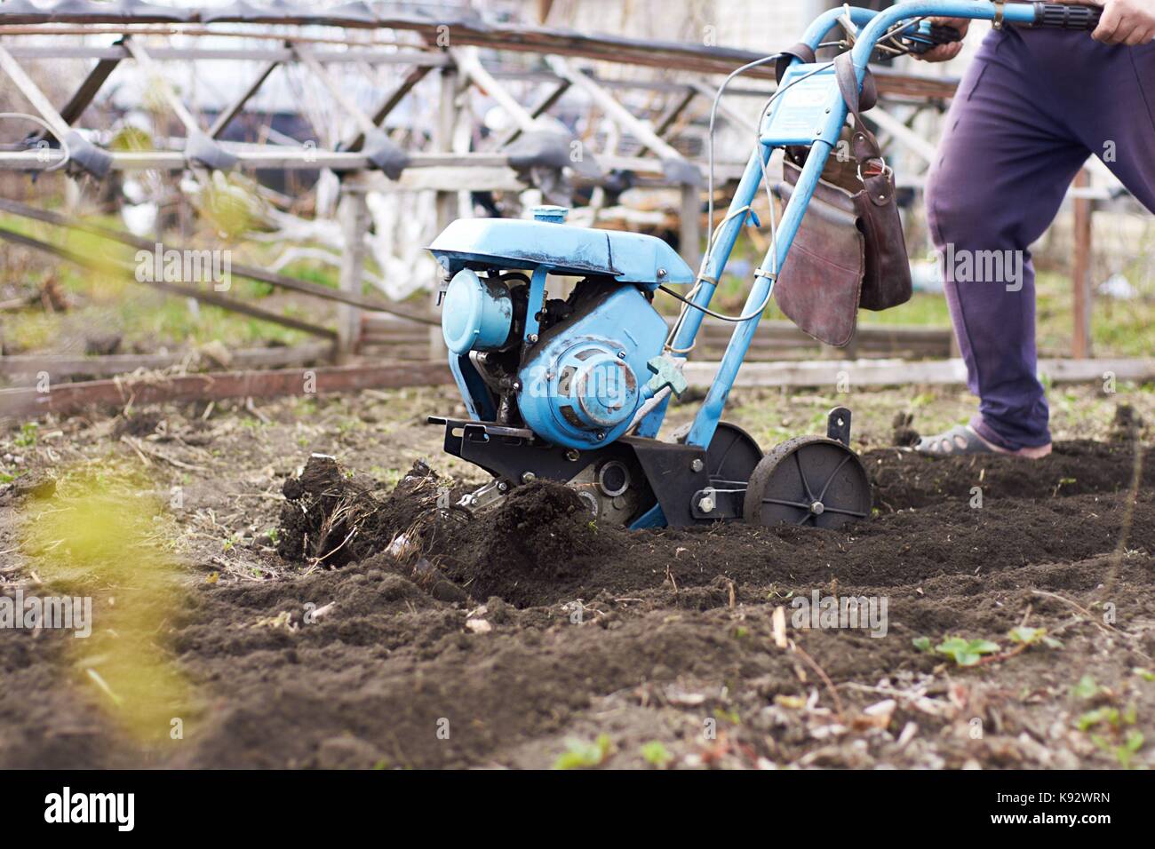 Plowing the earth. Garden. Equipment Stock Photo - Alamy