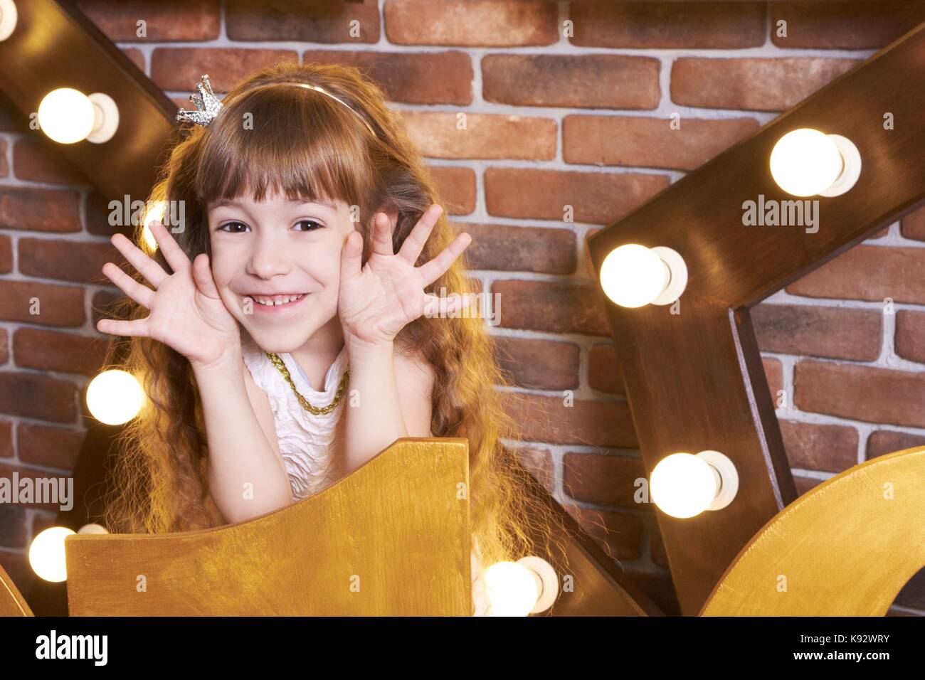 Christmas portrait. Girl. Child. Star background Stock Photo - Alamy