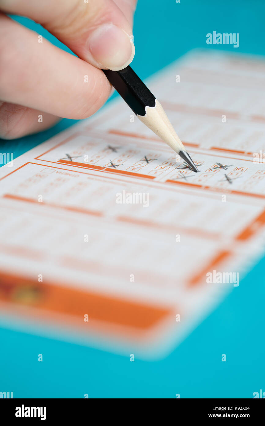 Picture of man's hand with lottery ticket Stock Photo - Alamy