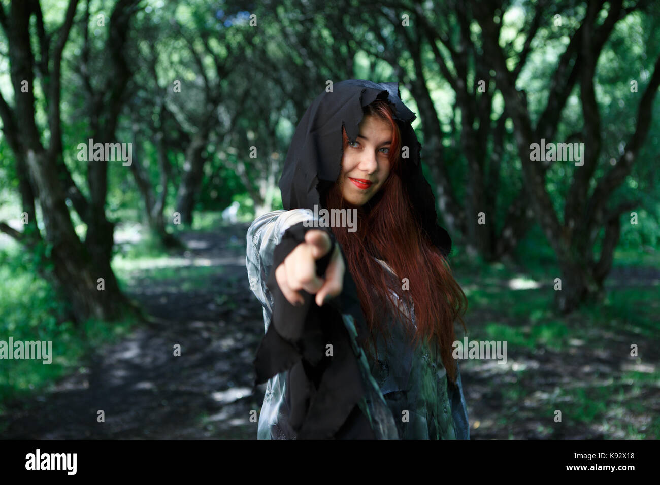 Witch pointing finger at camera Stock Photo - Alamy