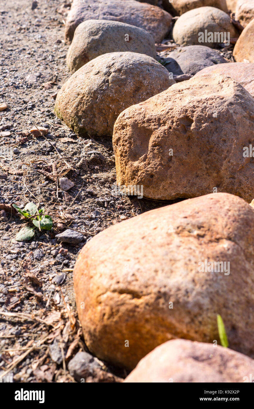 border of stones near the walkway. nature, peace Stock Photo - Alamy
