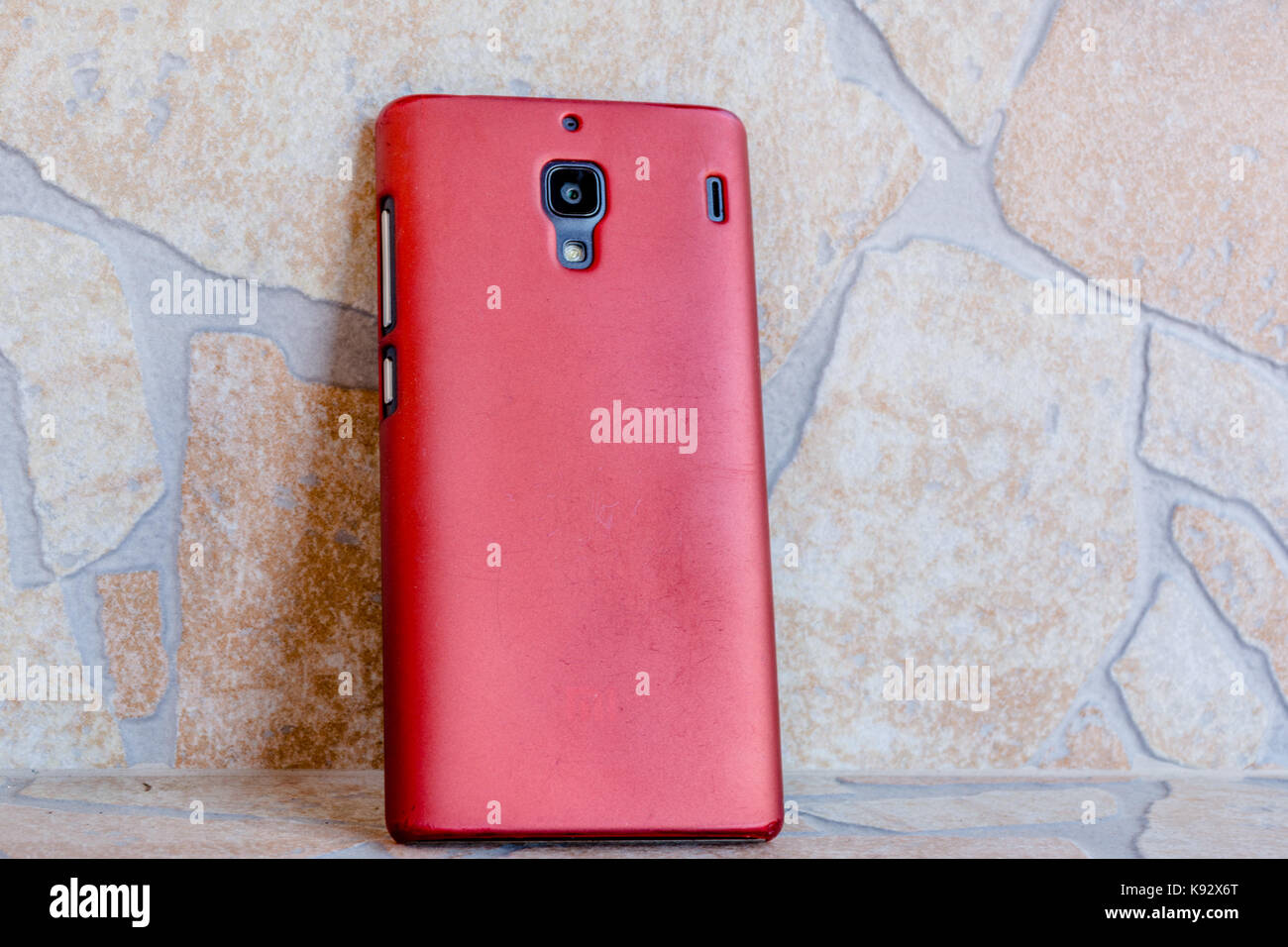 Smart phone red color isolated Stock Photo - Alamy