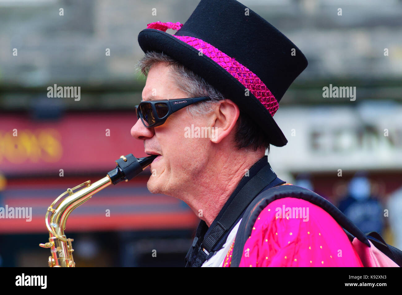 Male musician from The Ambling Band playing the saxophone at the ...