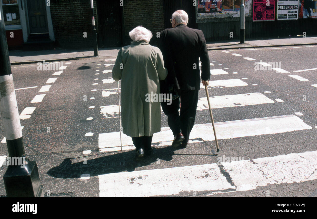 Old man walking stick crossing hi-res stock photography and images - Alamy