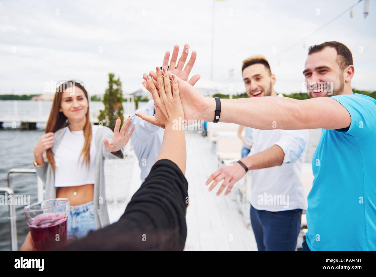 Friends congratulate his friend on his birthday Stock Photo - Alamy