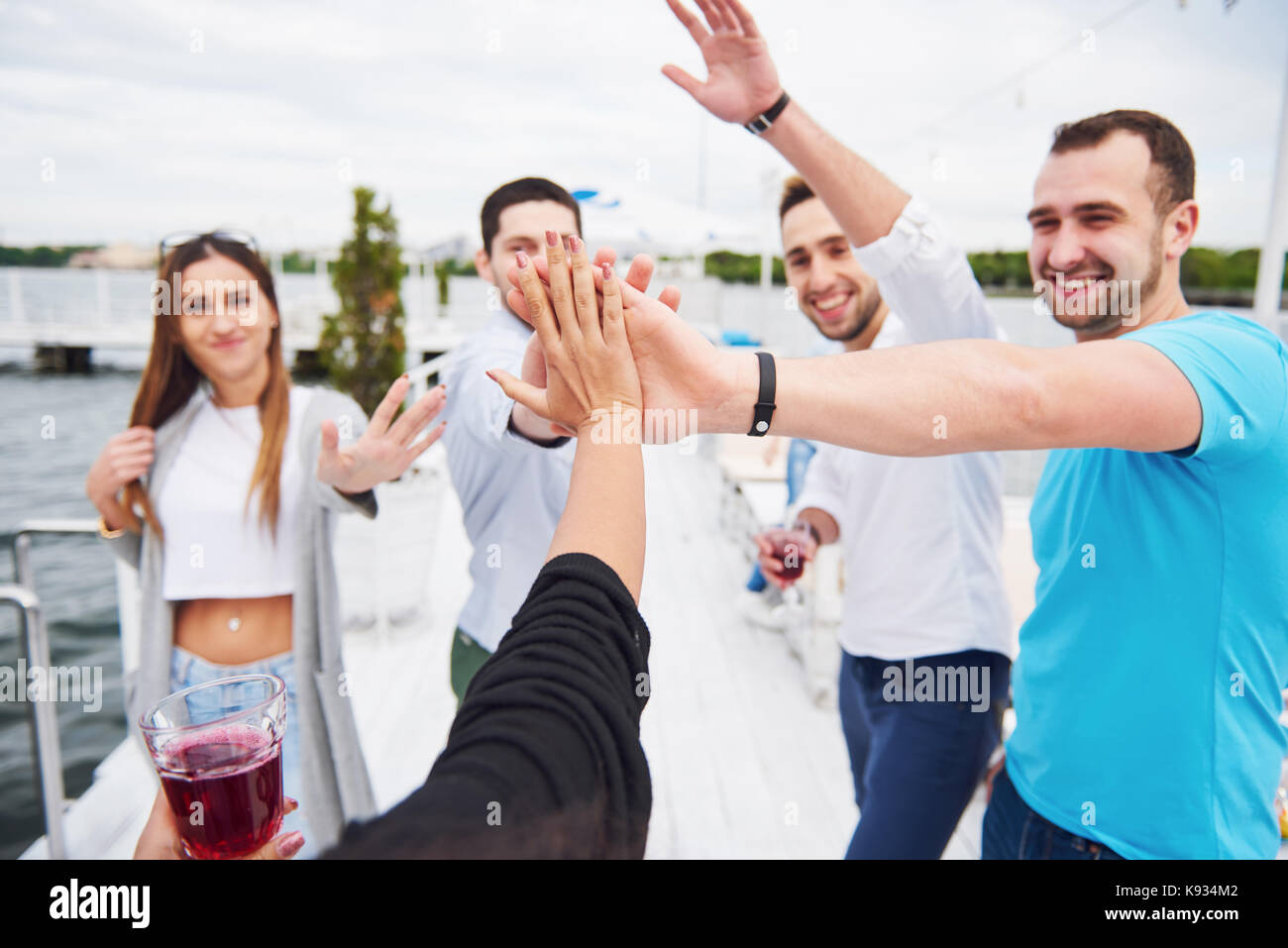 Friends congratulate his friend on his birthday Stock Photo - Alamy