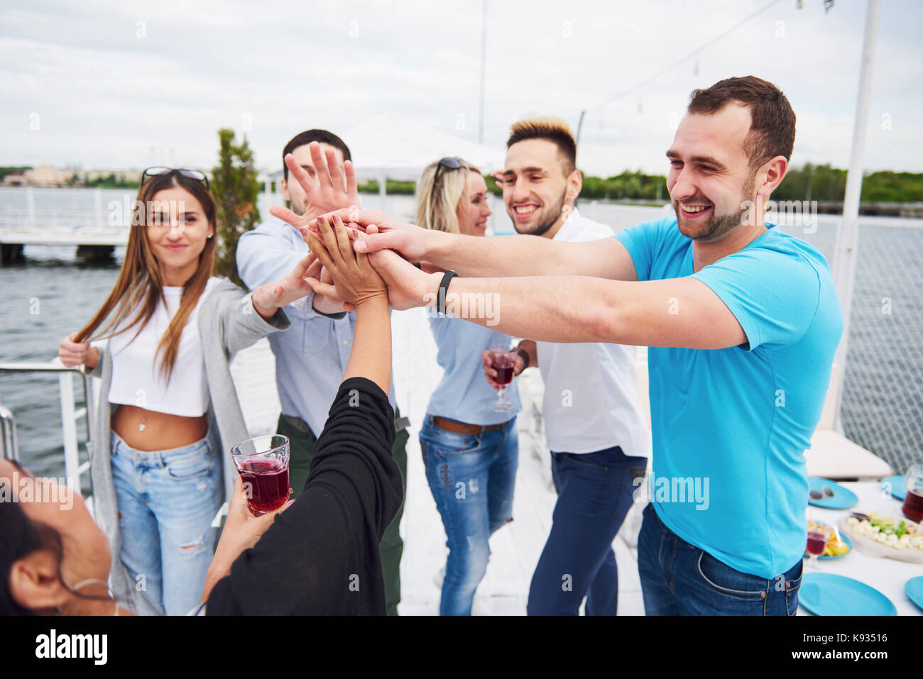 Friends congratulate his friend on his birthday Stock Photo - Alamy
