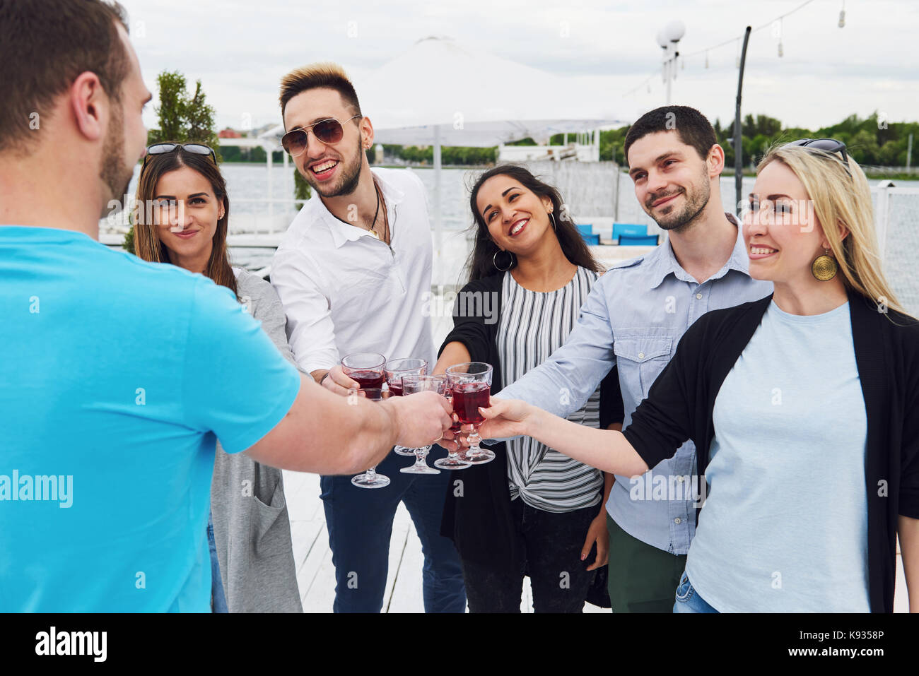 Friends congratulate his friend on his birthday Stock Photo - Alamy