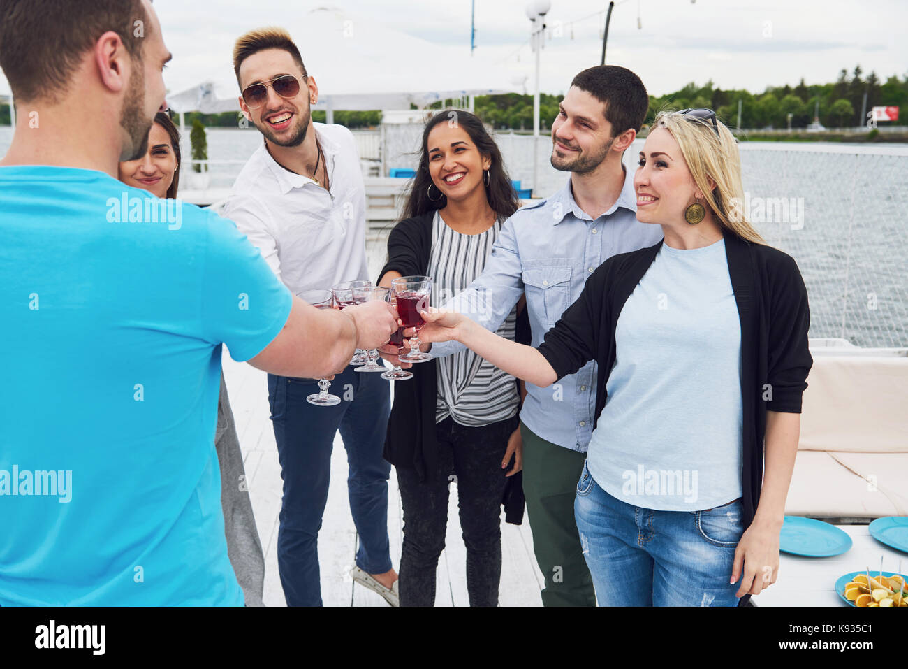 Friends congratulate his friend on his birthday Stock Photo - Alamy