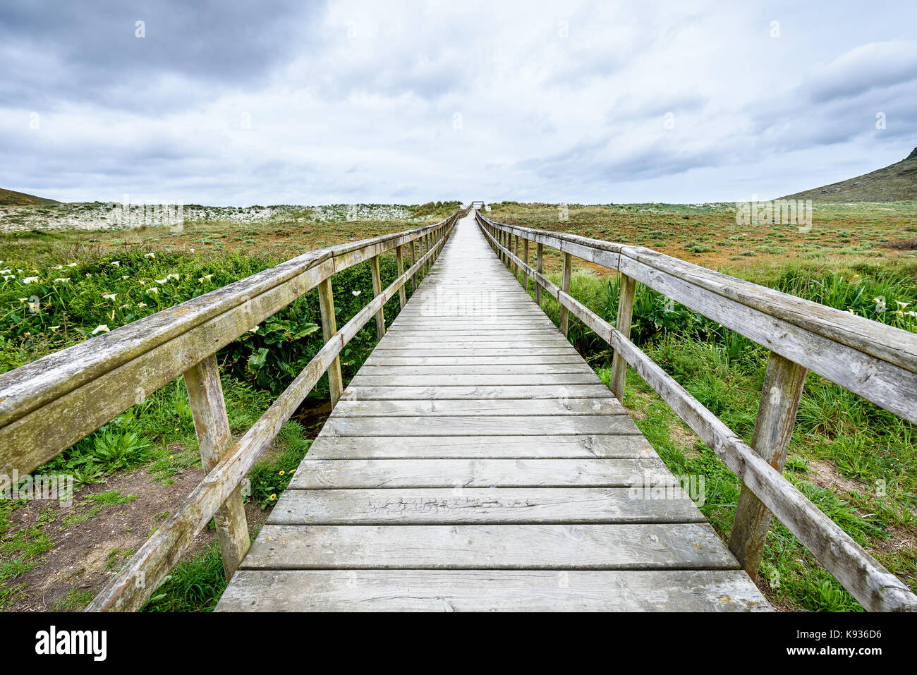Wooden pier leading resort on hi-res stock photography and images - Alamy