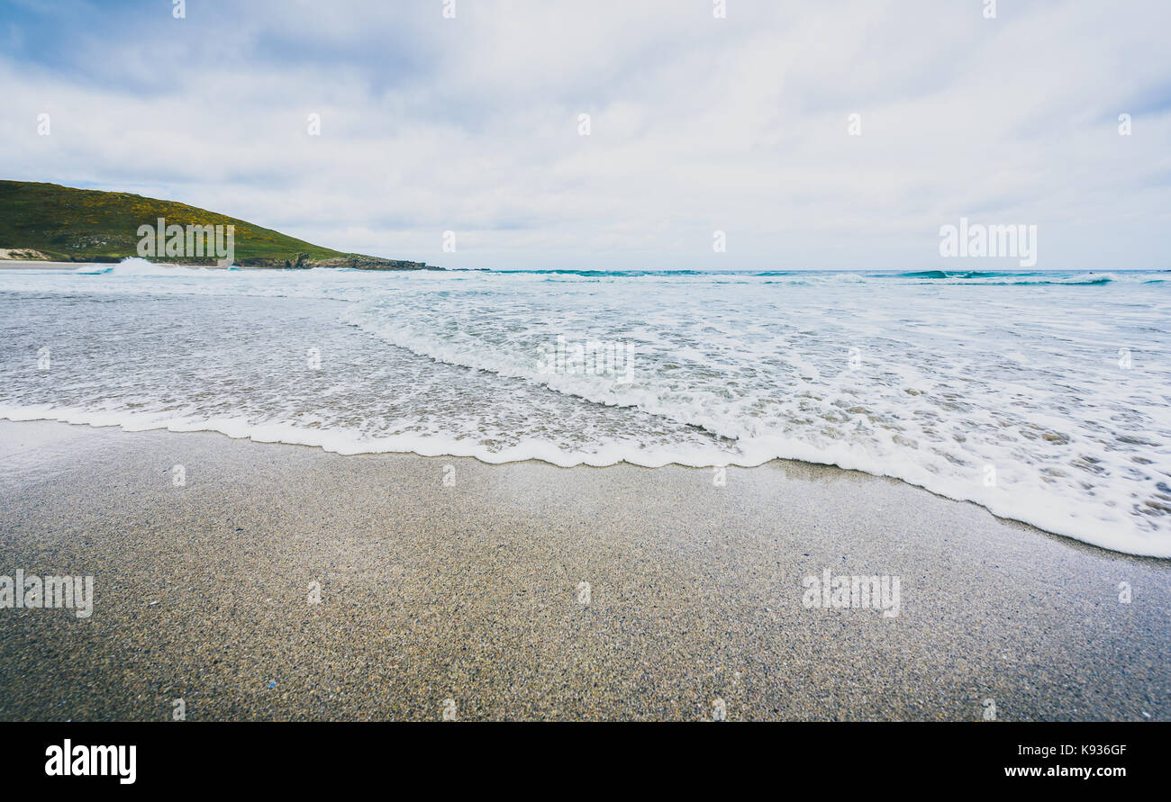 Small ocean sea waves on sandy beach in calm weather. Background ...