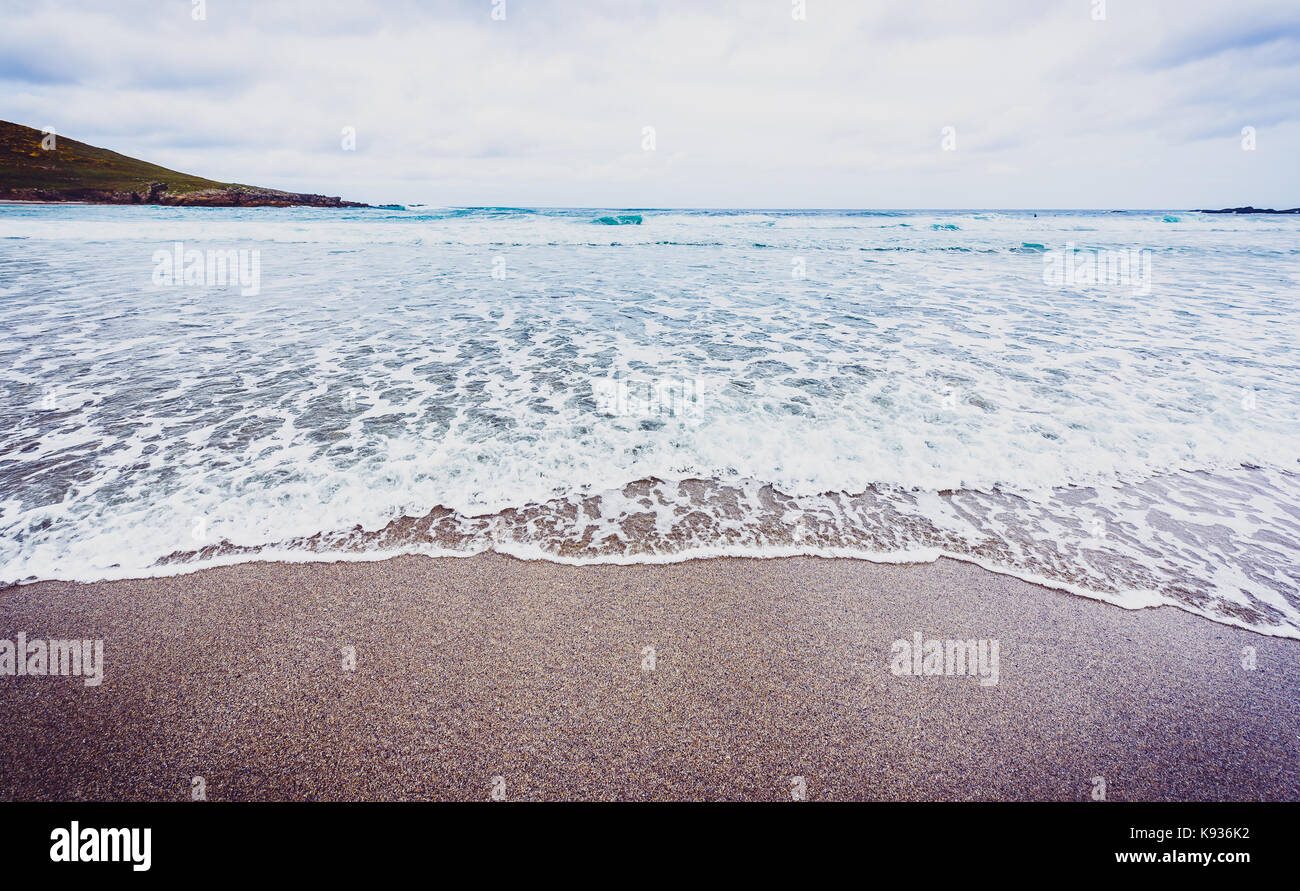 Small ocean sea waves on sandy beach in calm weather. Background ...