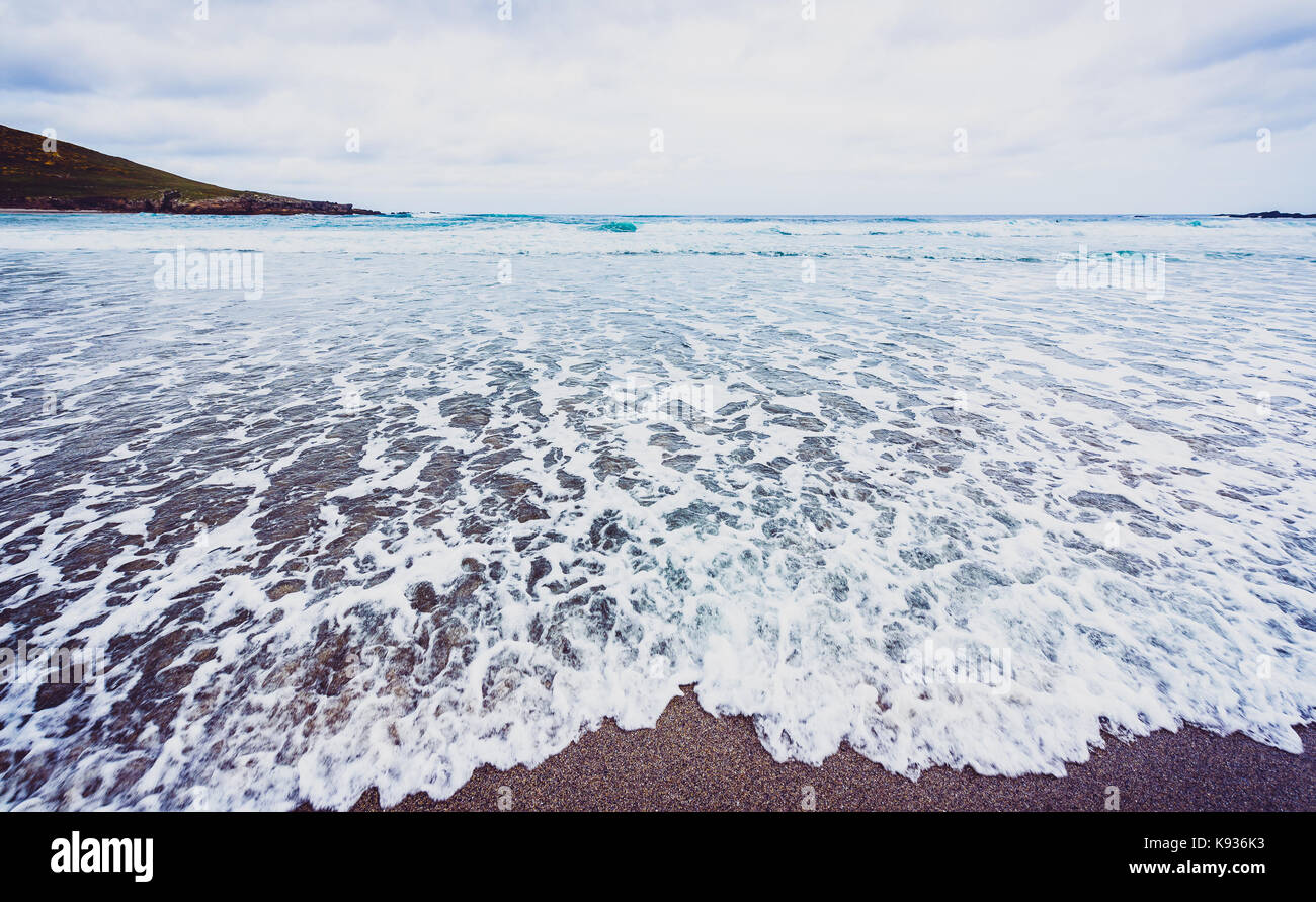 Small ocean sea waves on sandy beach in calm weather. Background ...