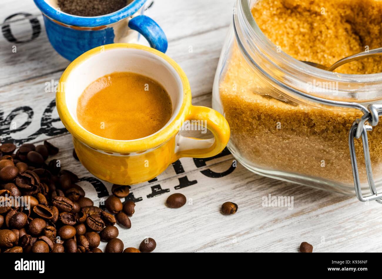 cup of coffee and coffee beans and cane sugar Stock Photo - Alamy