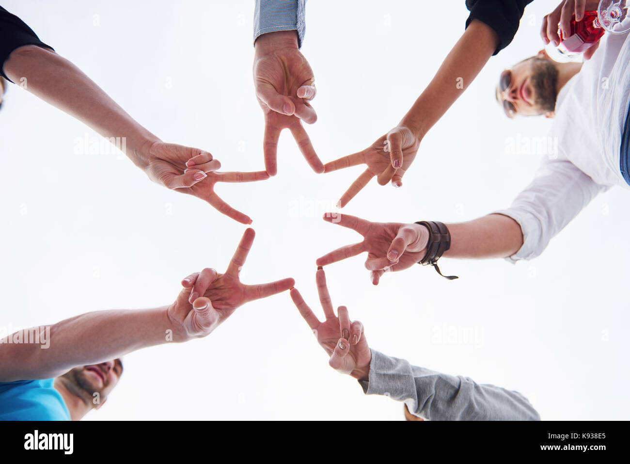 People forming star shape with their fingers Stock Photo - Alamy