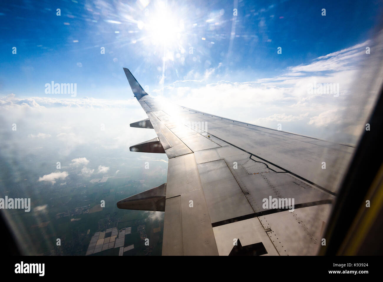 Looking trough window of an aircraft, airplane or plane wing. View from ...