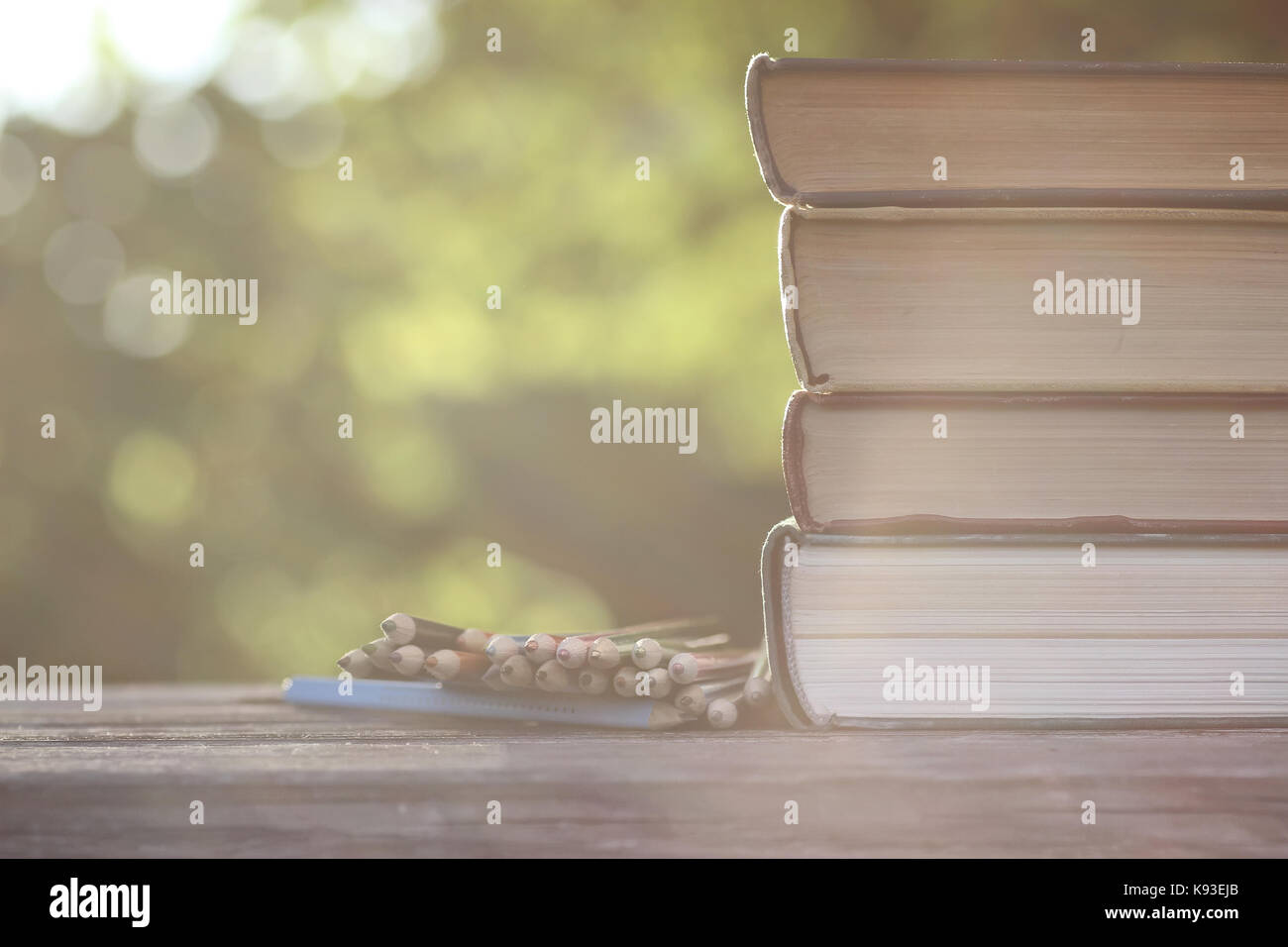 book stack background table wooden outdoor Stock Photo - Alamy