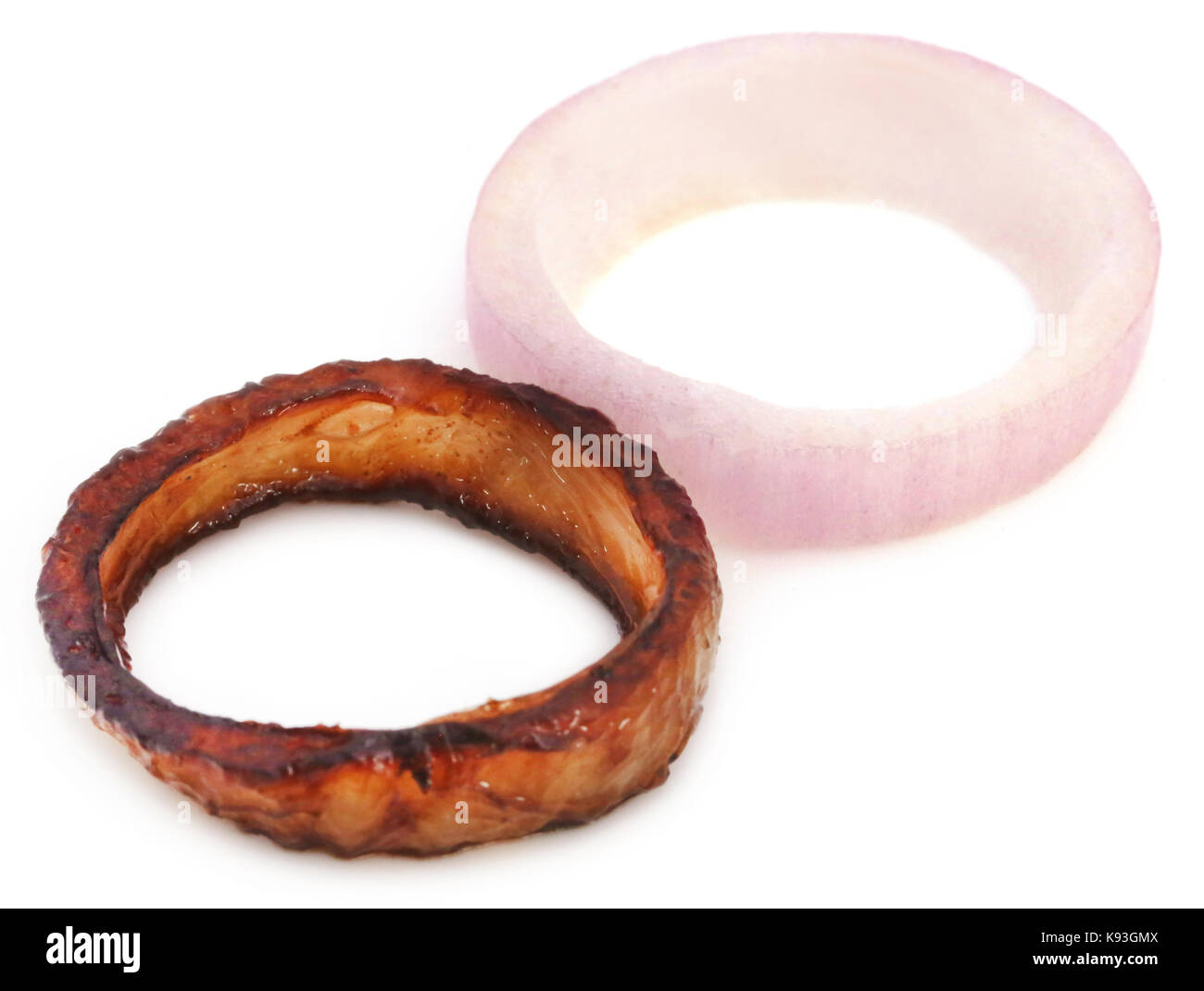 Sliced onion rings, fried and raw over white background Stock Photo - Alamy