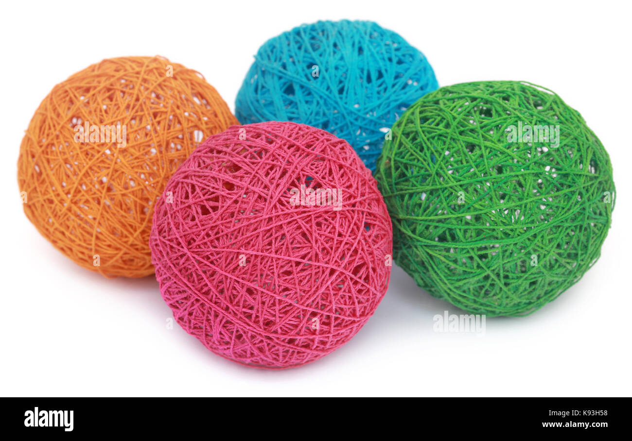 Decorative hollow thread rolls over white background Stock Photo - Alamy