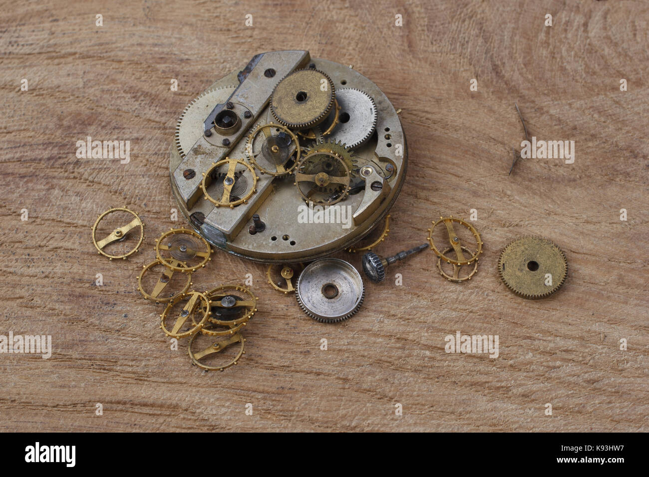 broken vintage pocket watch on wooden background Stock Photo - Alamy
