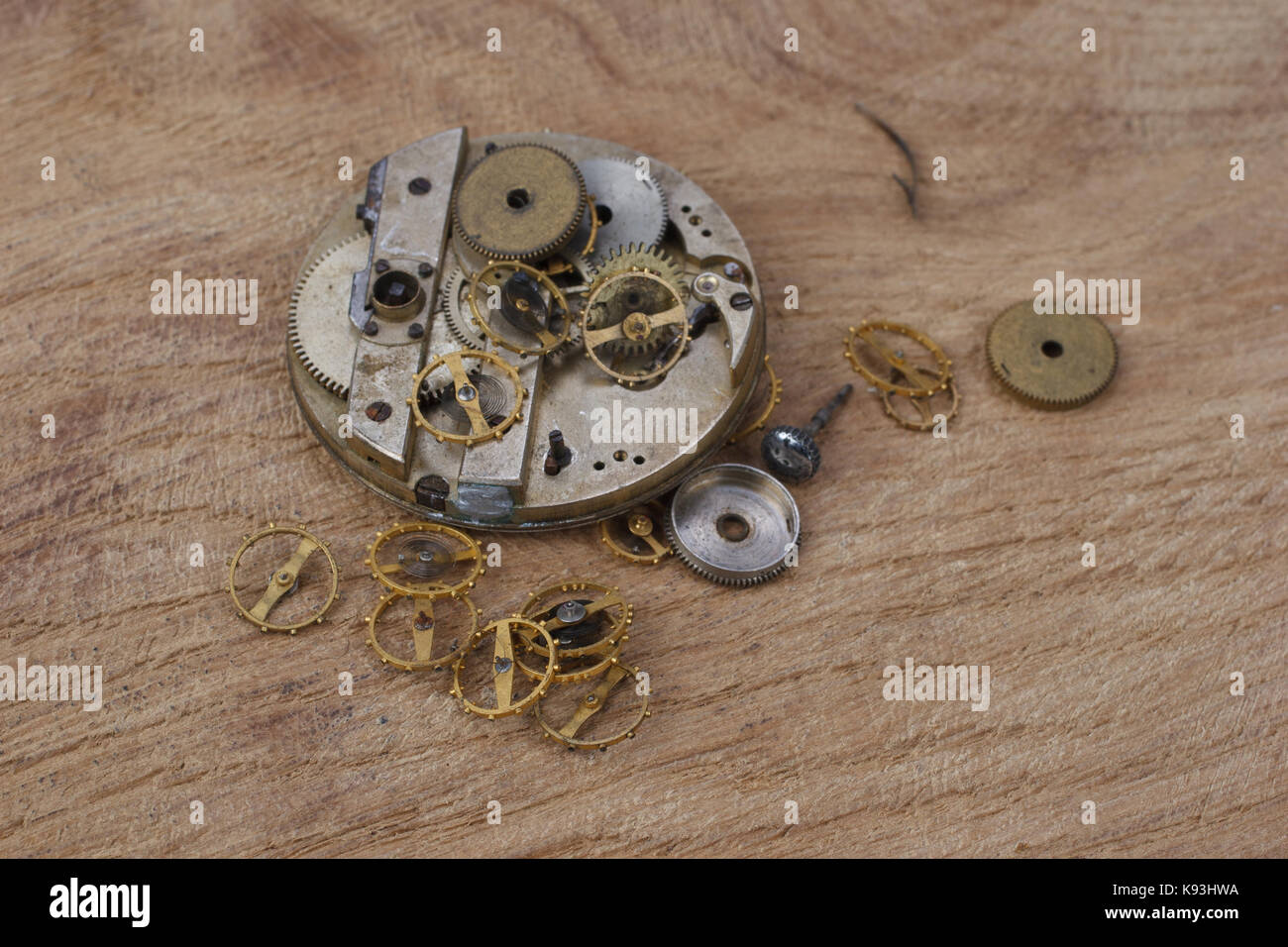 broken vintage pocket watch on wooden background Stock Photo - Alamy