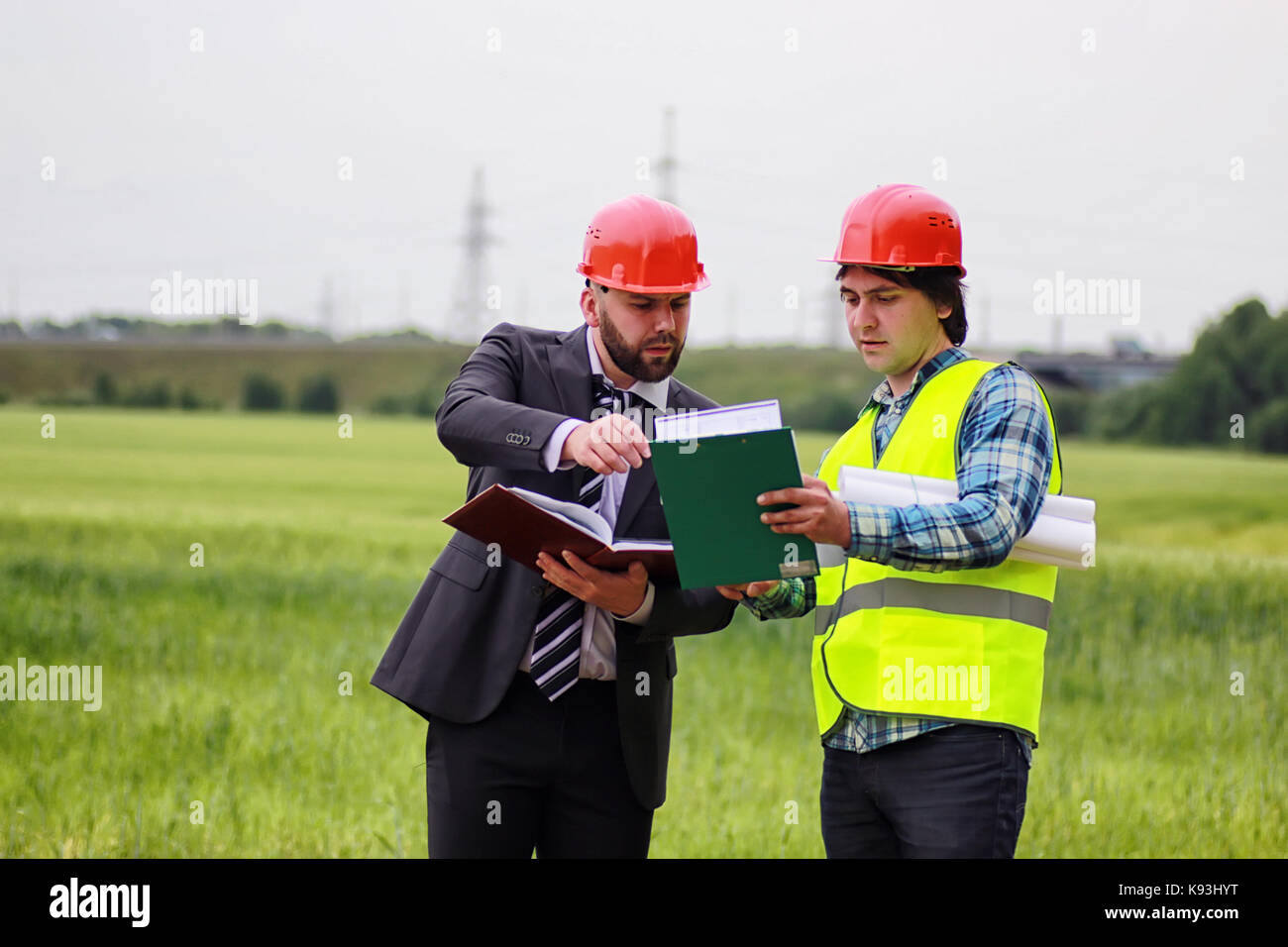 construction two man in the field Stock Photo - Alamy