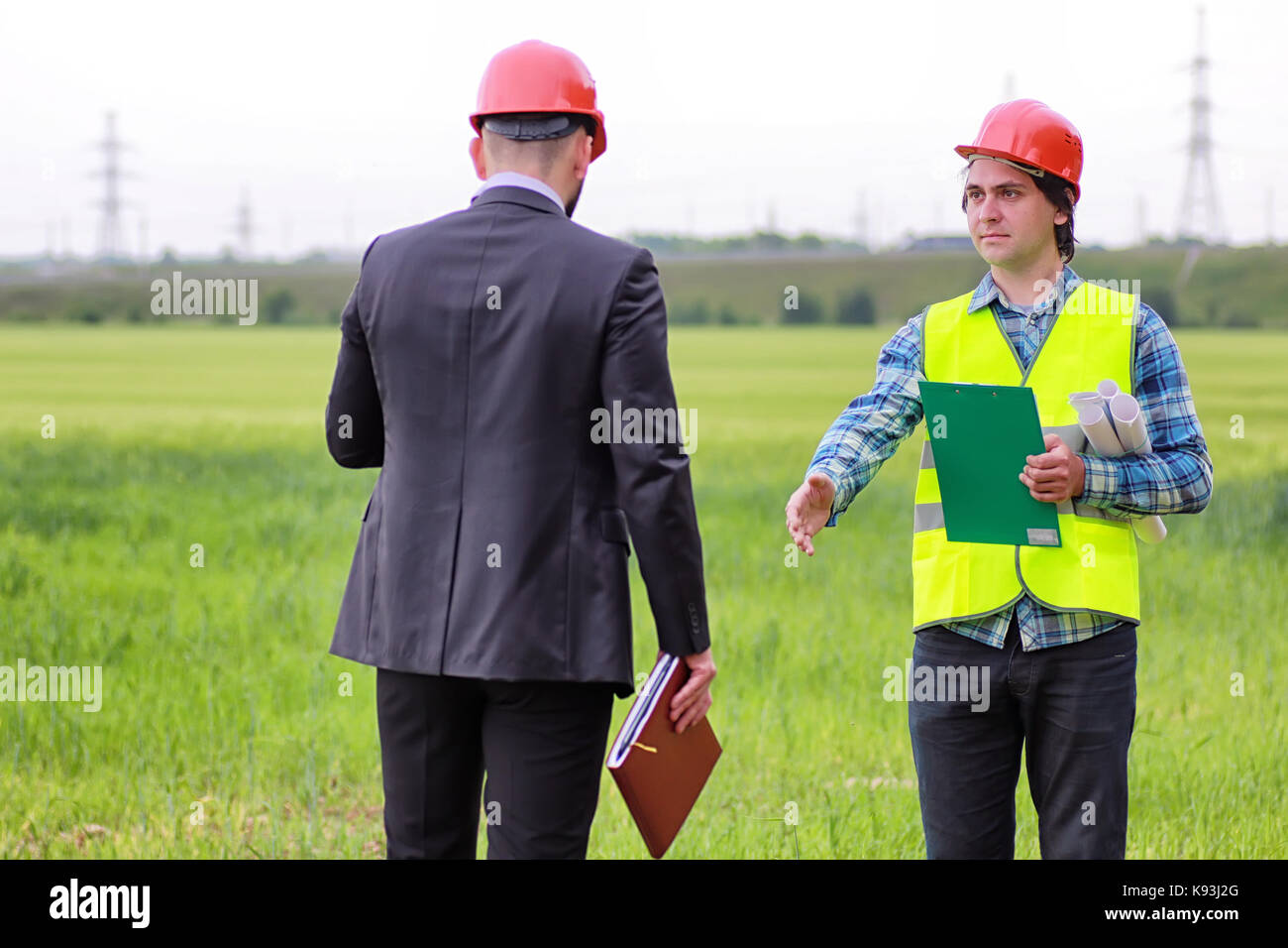 construction two man in the field Stock Photo - Alamy