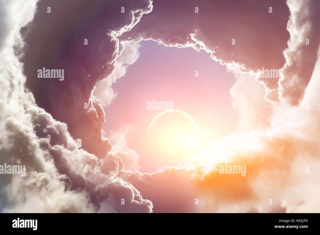 Sunlight pierces through the clouds Stock Photo - Alamy