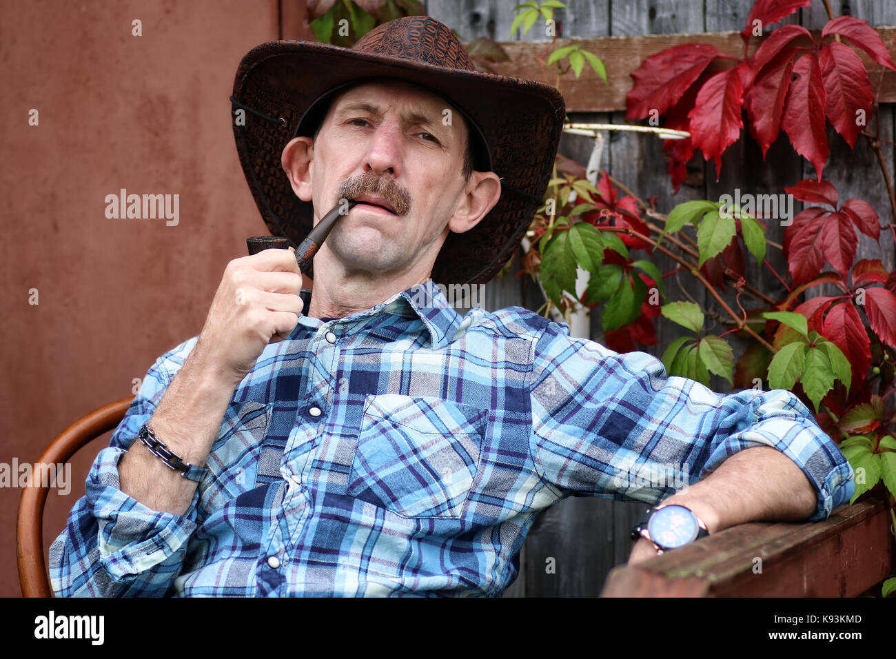 cowboy man smoke pipe Stock Photo - Alamy