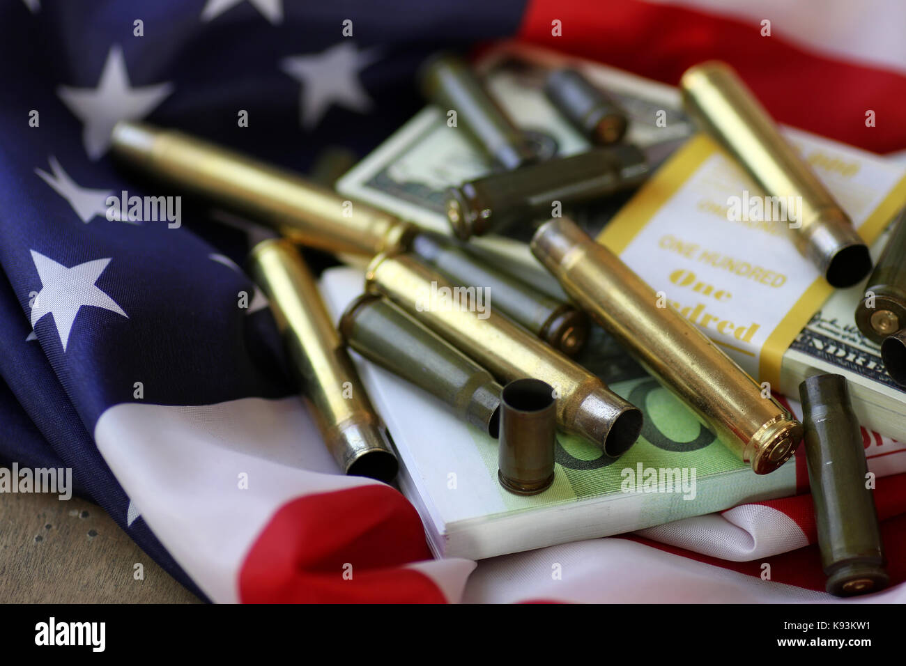 bullet and money on the american flag Stock Photo - Alamy