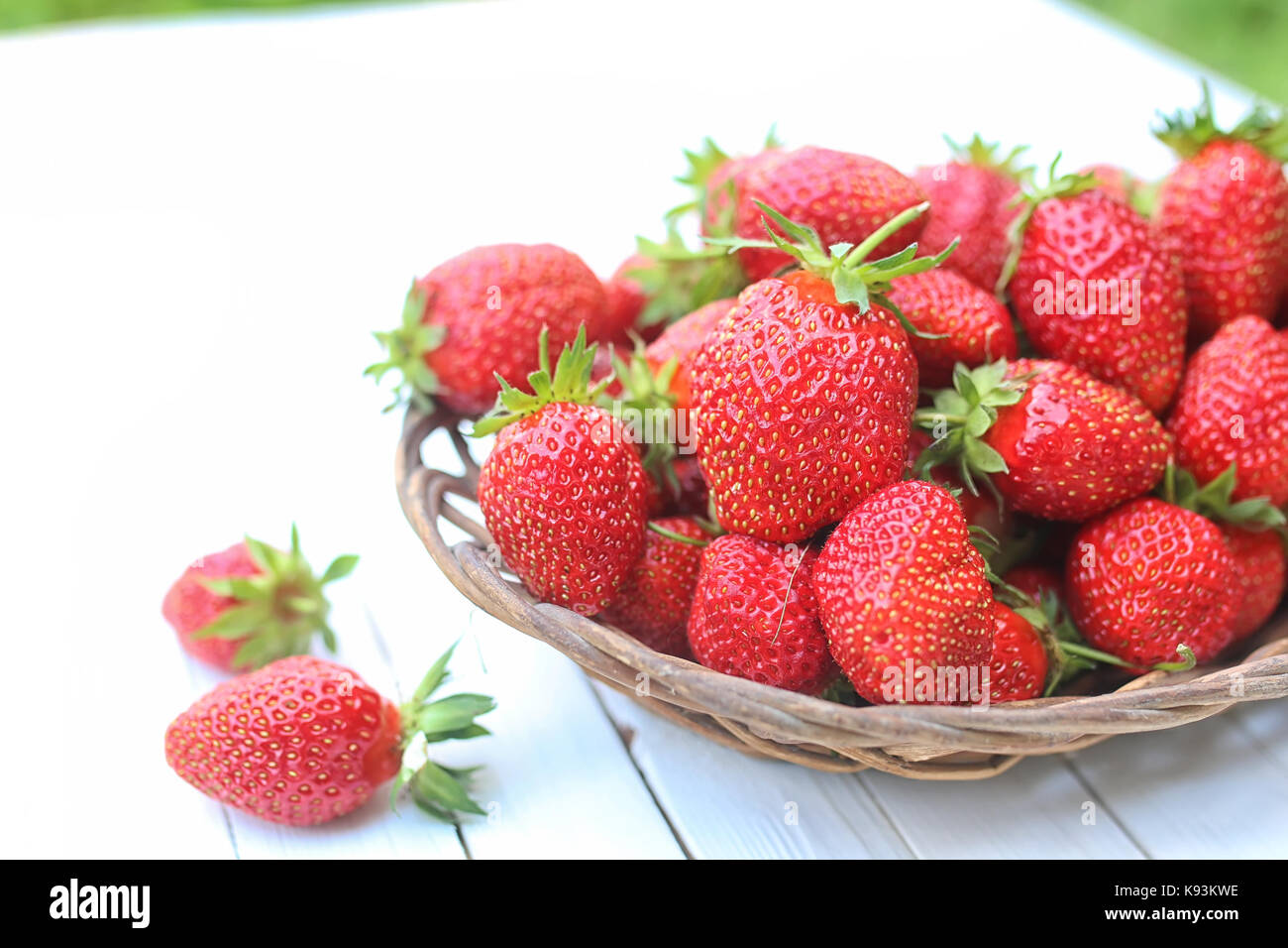 Strawberry on rustic wooden background Stock Photo - Alamy