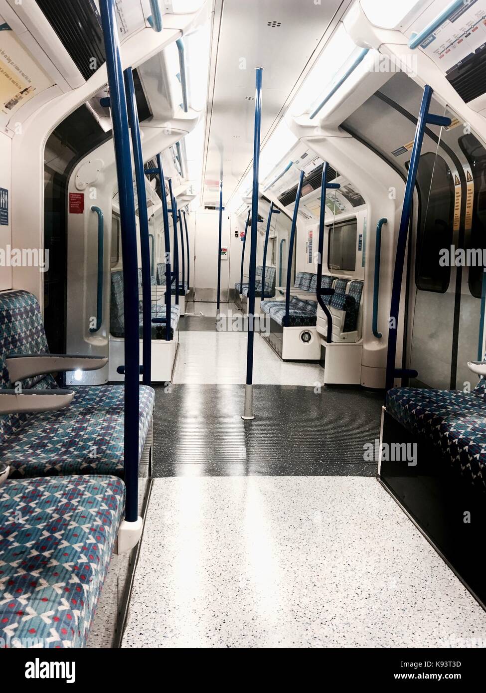 Travel concept. Blue underground train in London. Empty seats in public ...